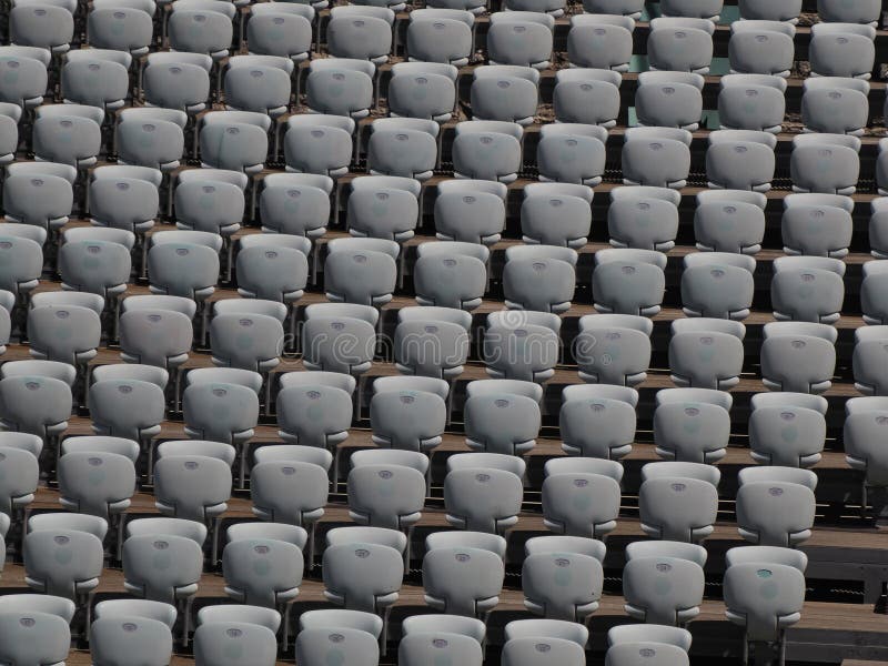 Rows of Numbered Empty Plastic Seats at an Open-air Amphitheater. Many ...