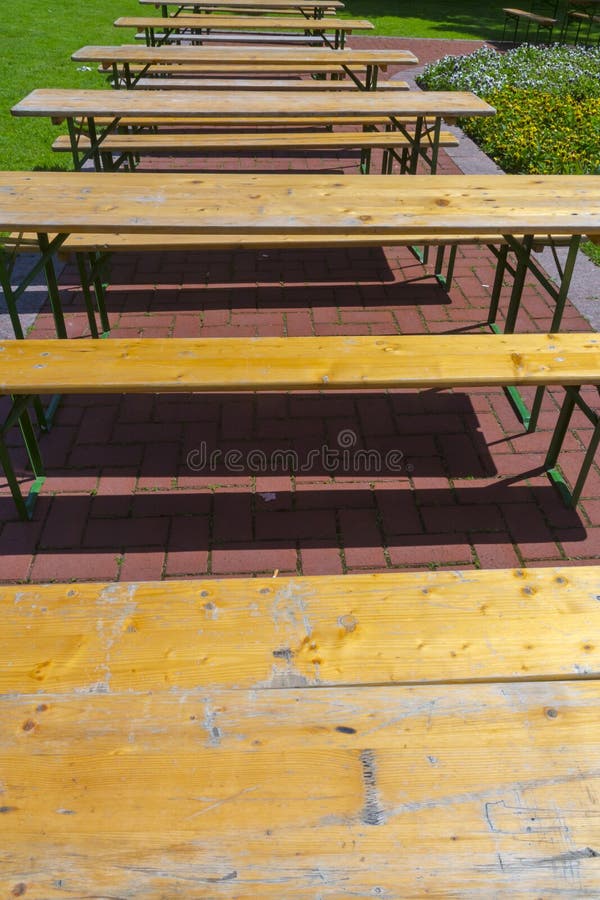 Rows of Outdoor Wooden Benches on a Sunny Day Stock Image - Image of ...