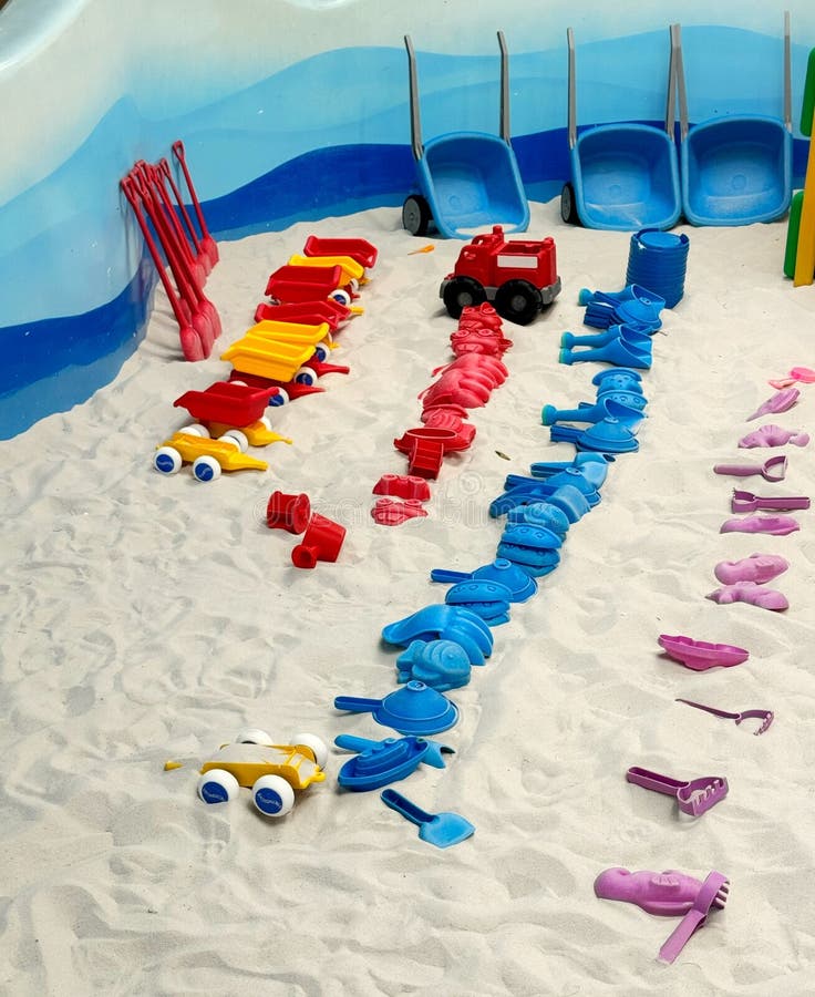 Rows of Plastic Toys in a Sand Pit Kids Playground Stock Photo - Image ...