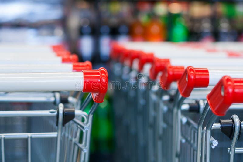A Rows of Push Carts in a Supermarket Stock Image - Image of blur ...