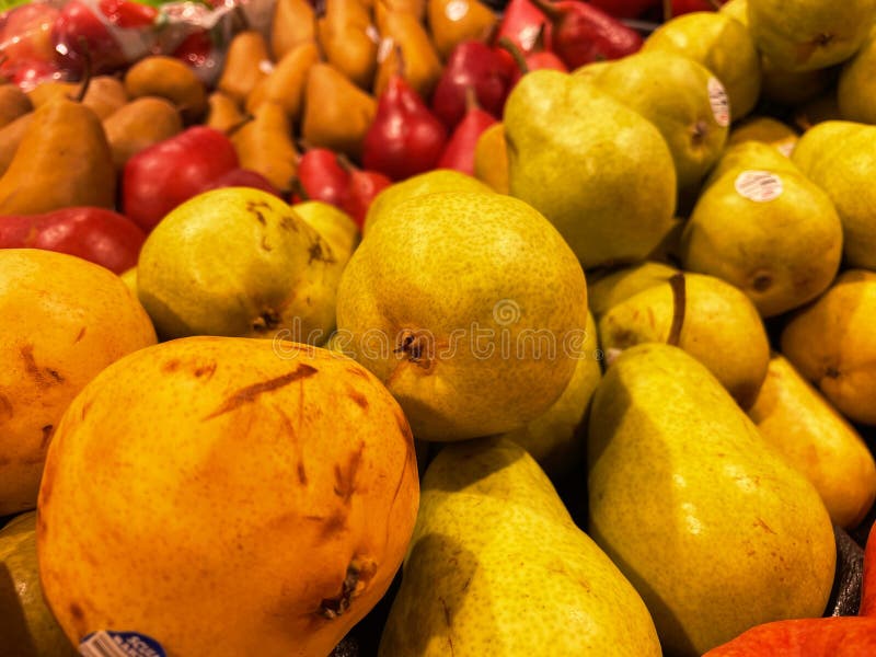 Rows of Red and Brown Pears on Display in a Grocery Store Large Stock ...