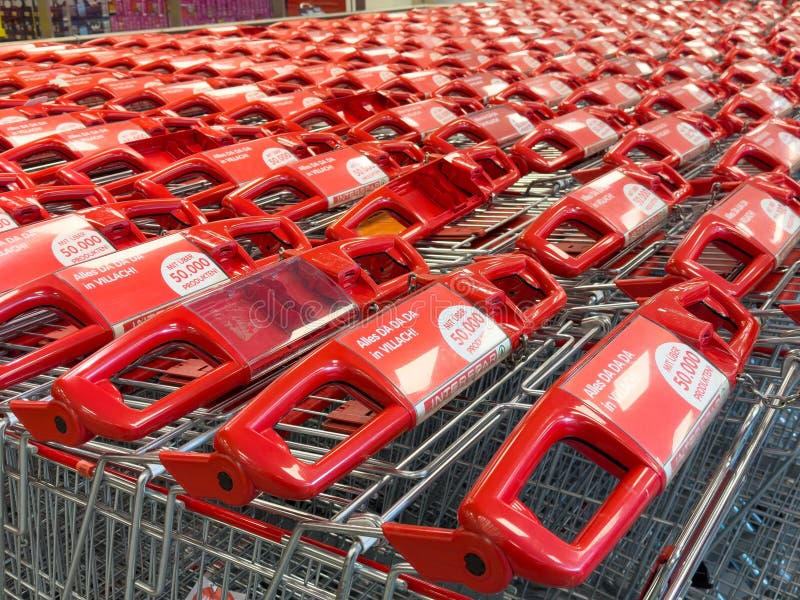 Rows of Red Shopping Carts with Red Handles in Store Aisle Editorial ...