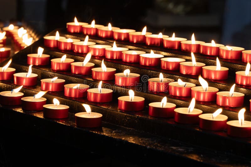 Rows of Red Tealight Candles Burning Stock Photo - Image of light, warm ...