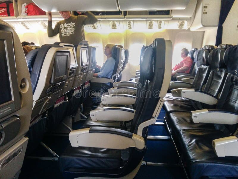Rows of seats in the cabin editorial stock photo. Image of flying ...