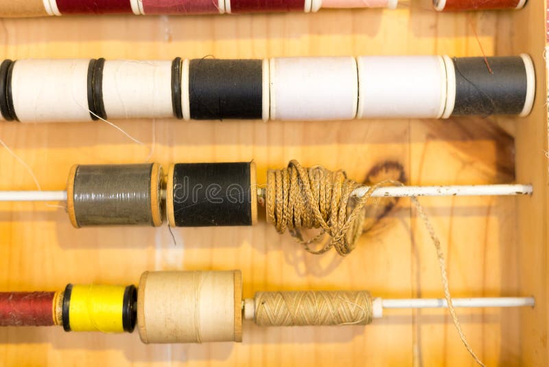 Rows of Sewing Color Threads Frame on Wooden Table Stock Photo - Image ...