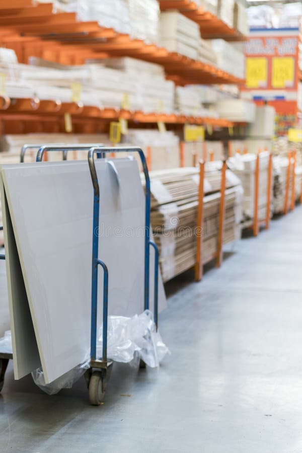 Rows of Shelves with Boxes and Storage Carts in Modern Warehouse Stock ...