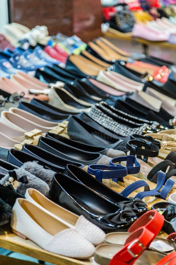 Rows of shoes on a table stock image. Image of casual - 85555761