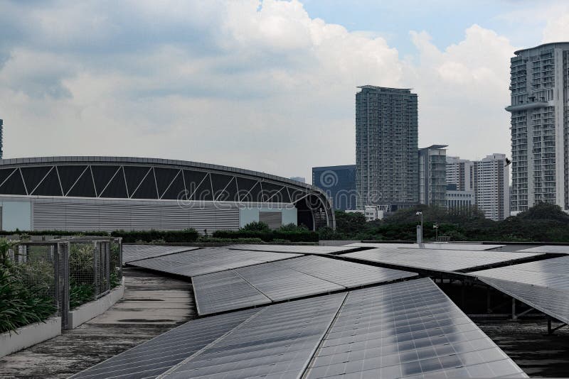 Rows of the Solar Panels Against the High Rise Buildings in a City ...