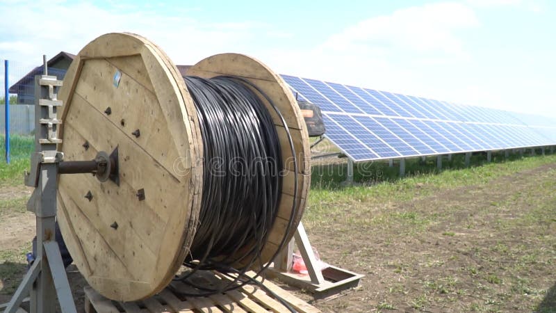 Massive Roll of Cable is Unwinding at a Construction Site of Solar ...