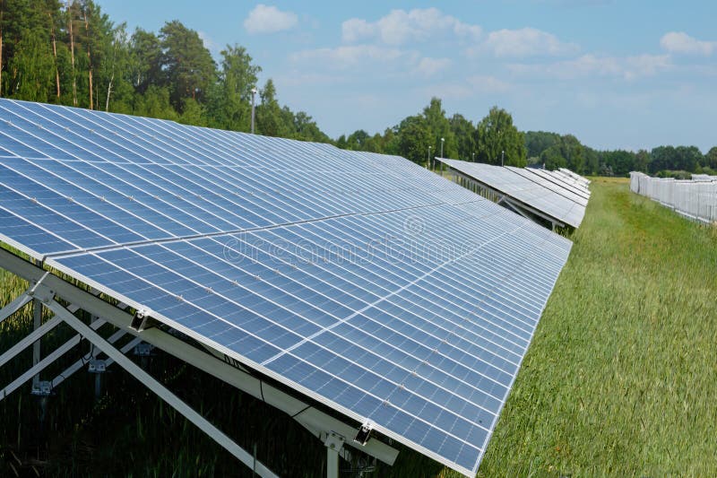 Rows of Solar Panels in a Field. Solar Power Plant. with Solar Panels ...