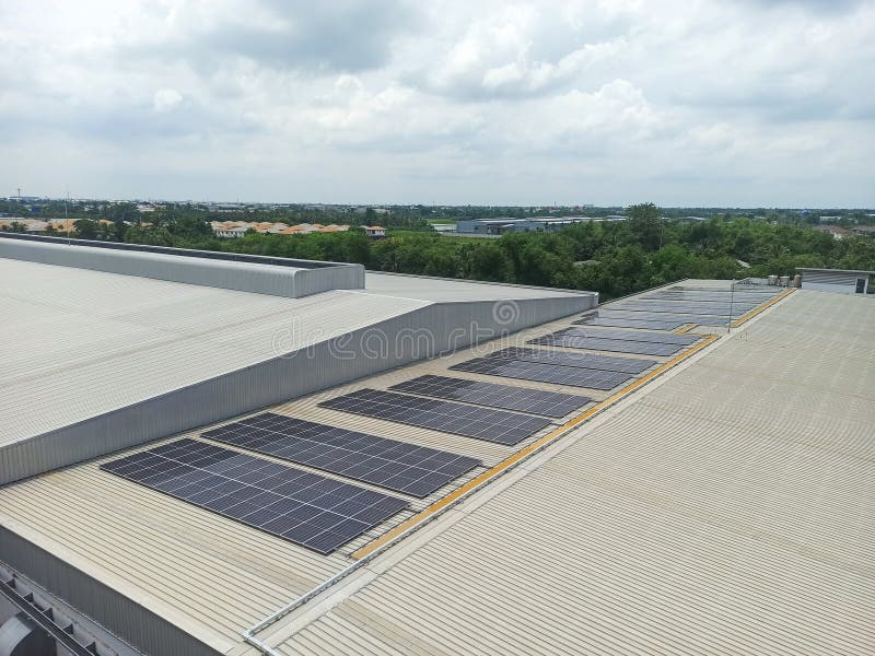 Rows of Solar Panels Installed on a Large Building Rooftop. Stock Image ...