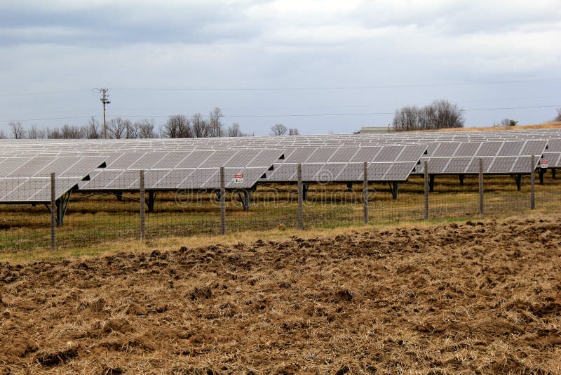 Rows of Solar Panels Out in the Middle of a Field Stock Image - Image ...