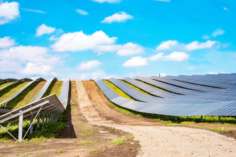 Rows of Solar Panels on the Steep Hills of the Field Stock Photo ...