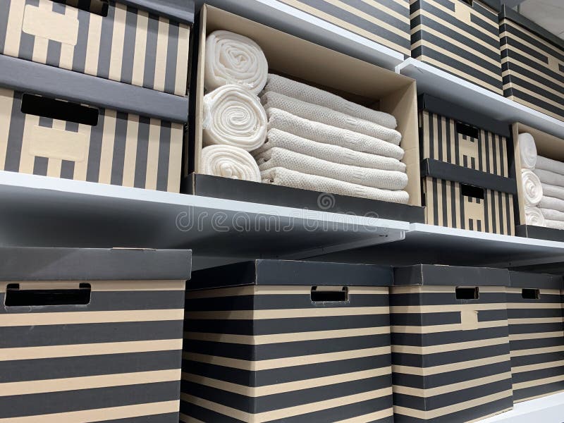 Rows of Stacked Storage Carton Boxes and Home Textyle Stacked on ...