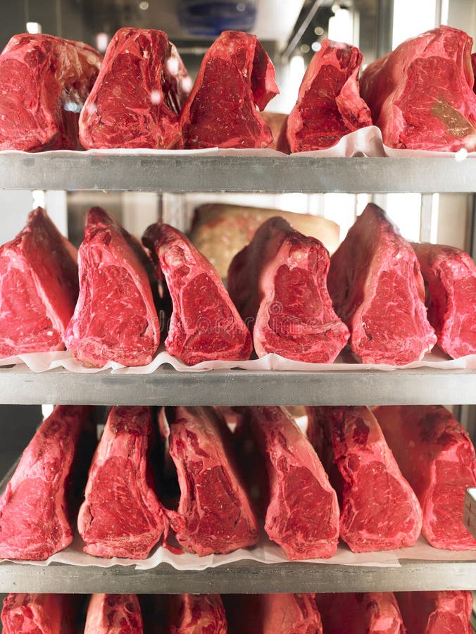 Rows of Steak on Metal Racks Stock Image - Image of butcher, cooler ...