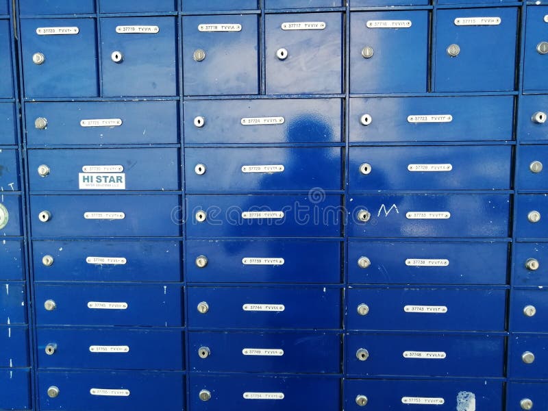 Rows of Vibrant Blue Post Office Boxes with Locks and Labels. Classic ...