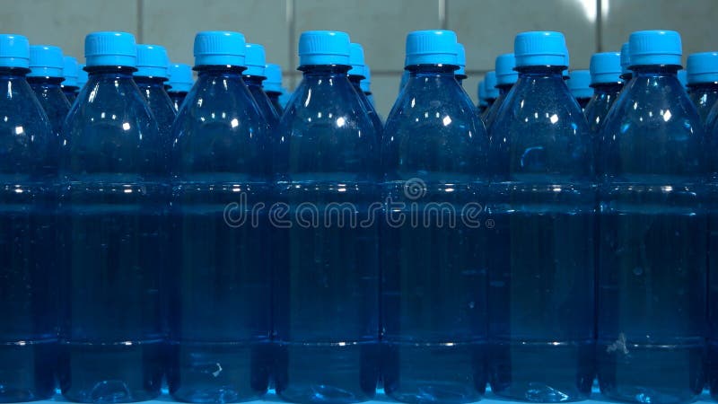 Rows of water bottles. stock photo. Image of improving - 148770134