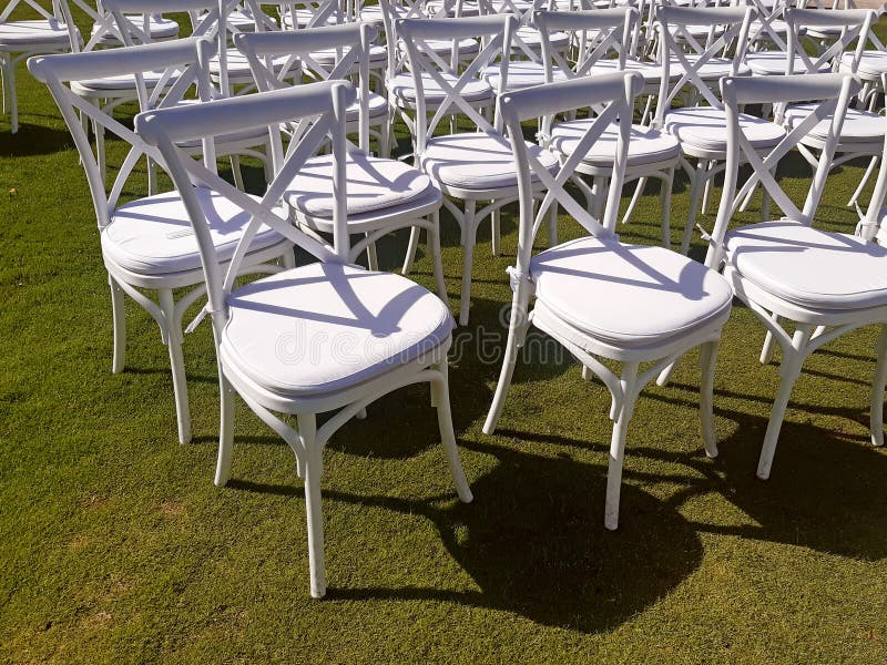 Rows of White Folding Chairs on Lawn before a Ceremony. White Chairs in ...