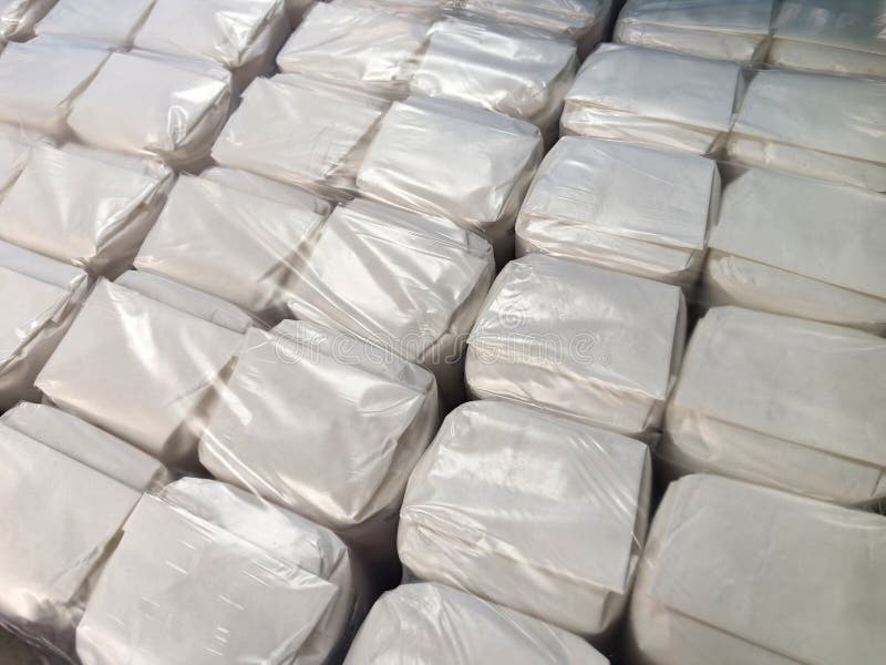 White Packages Stacked Neatly in a Warehouse Ready for Distribution ...