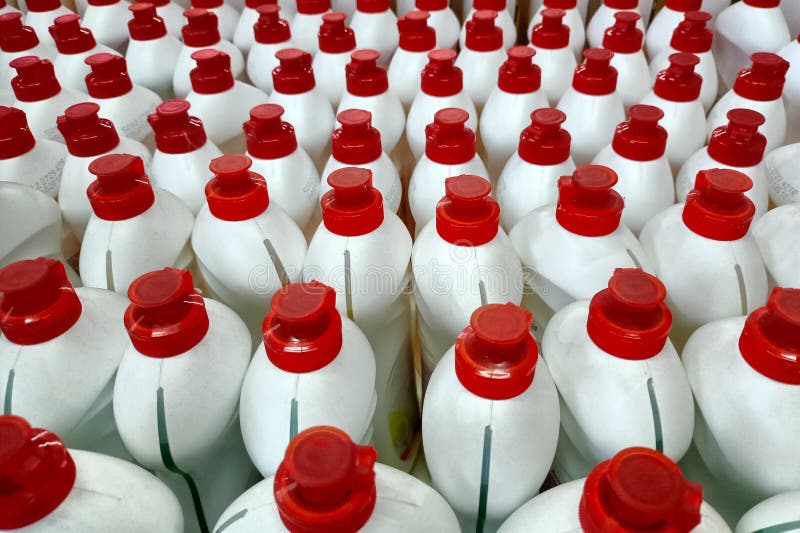 Rows of White Plastic Bottles with Red Caps Stock Image - Image of ...