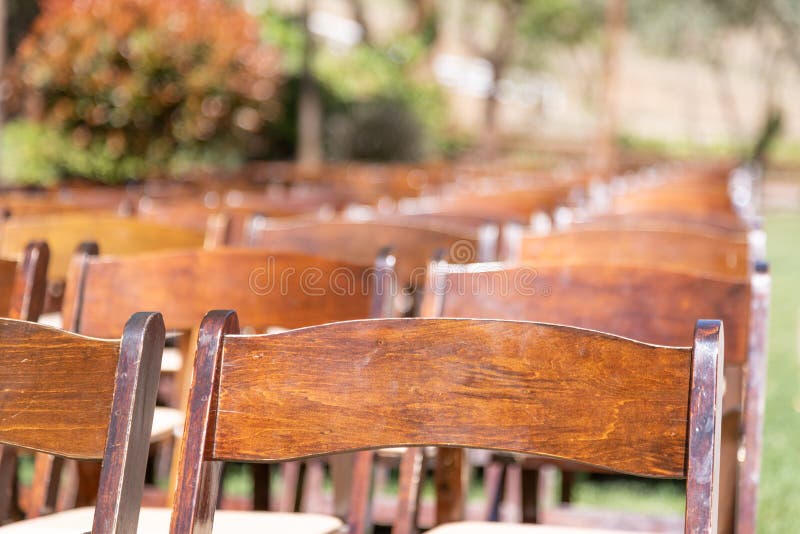 Rows of Wooden Event Chairs Outdoors at Wedding Venue Abstract Stock ...