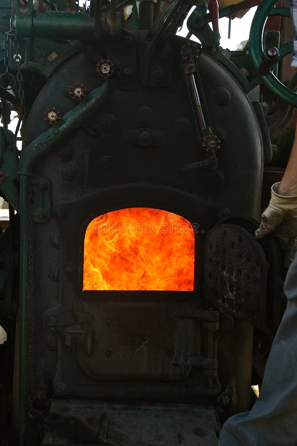 RThe Open Door of a Firebox on a Steam Engine Exposes the Hot Flames ...