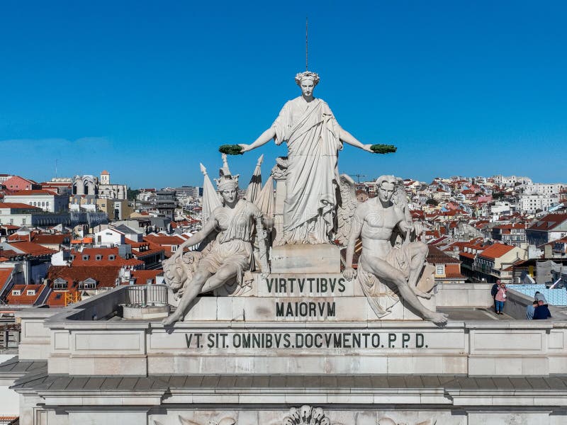 The Rua Augusta Arch in Lisbon, Portugal. Statues and Monument Stock ...