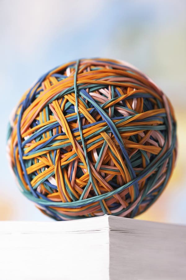 Rubber Band Ball on Book stock image. Image of selective - 29657205