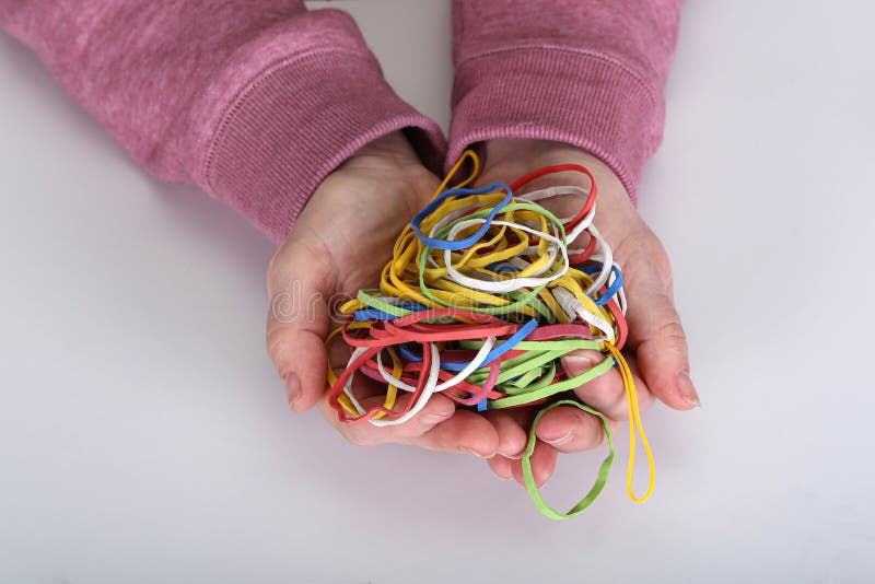 Rubber bands in hands stock photo. Image of rubber, colorful - 200120812
