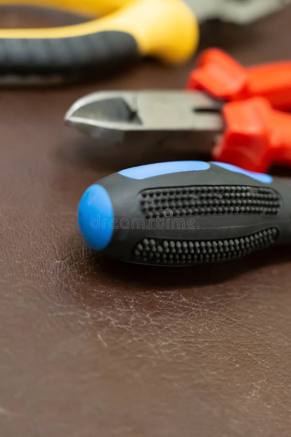 Rubber Black Screwdriver Handle and Wire Cutter Vertical Photo Hand ...