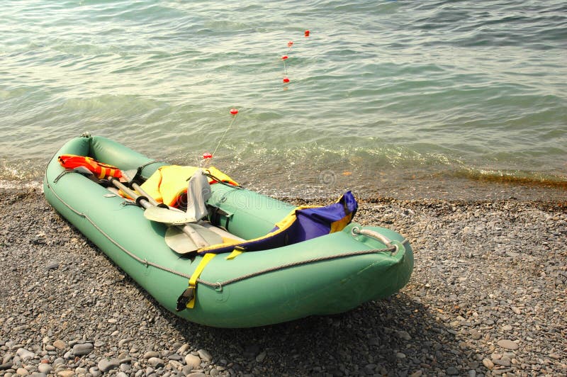 Rubber boat on the beach stock image. Image of activity - 67431557