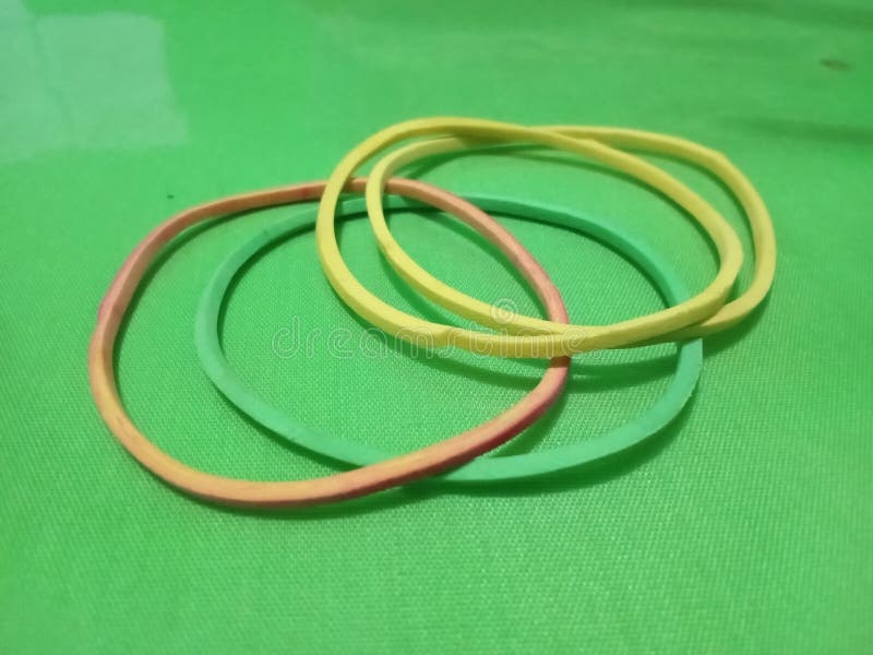 Rubber Bracelets on a Green Table Stock Photo - Image of table ...