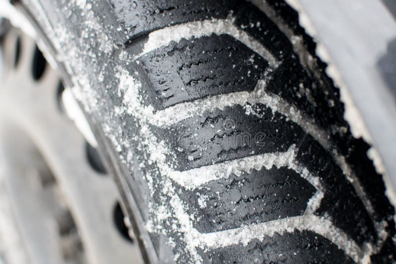 Rubber Car in the Snow. Tire Tread Clogged with Snow Stock Photo ...