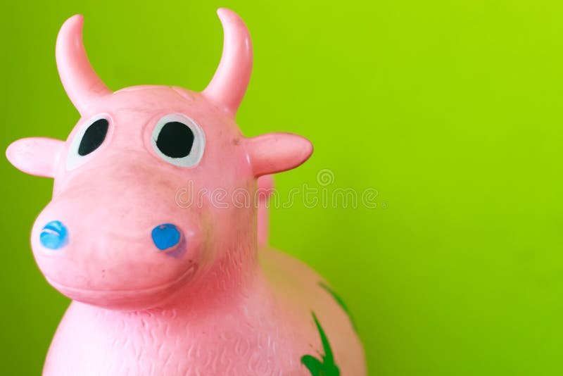 Rubber Cow Isolated on Green Background. Stock Photo - Image of ...