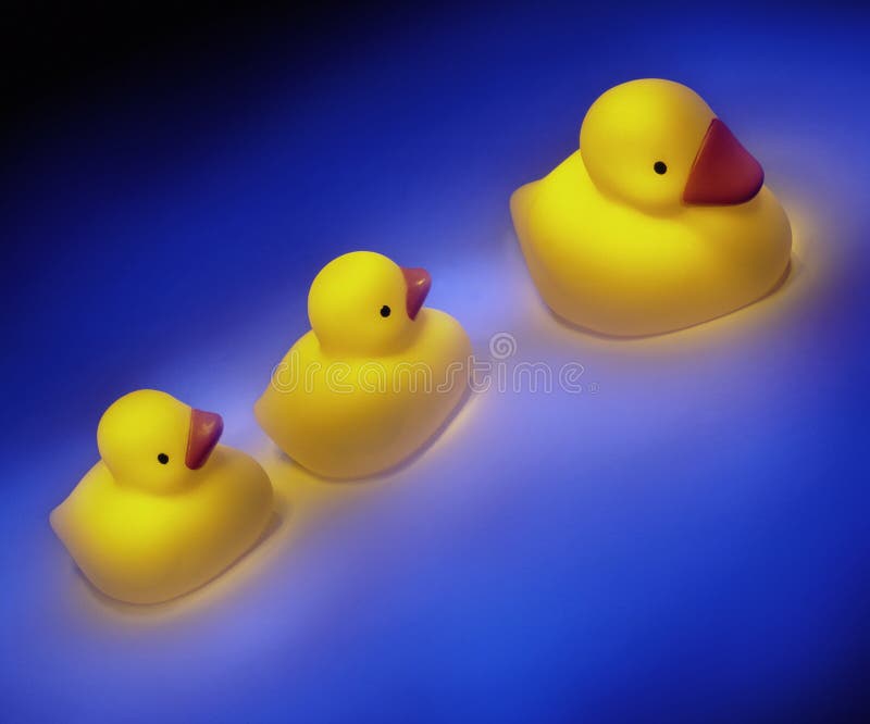 Three Rubber ducks stock image. Image of idea, yellow - 185880615