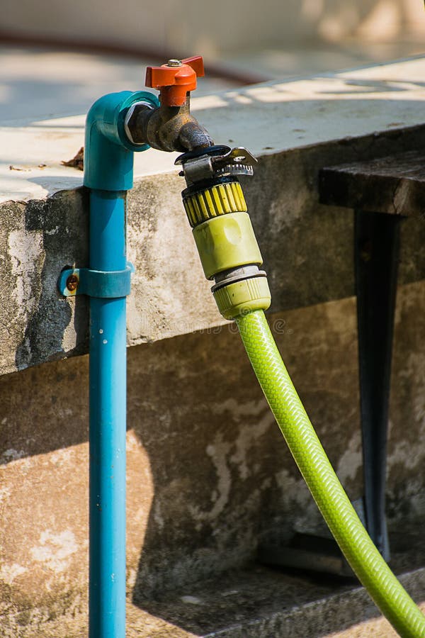 Rubber Hose Attached To a Faucet Inside the Fence Stock Photo - Image ...
