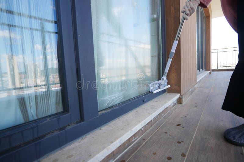 Rubber Squeegee Cleans a Soaped Window. Stock Photo - Image of service ...