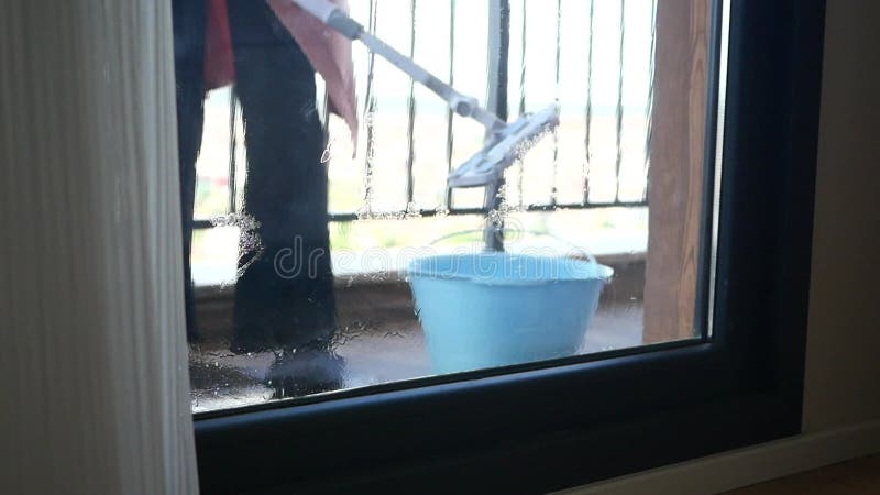 Rubber Squeegee Cleans a Soaped Window. Stock Video - Video of ...