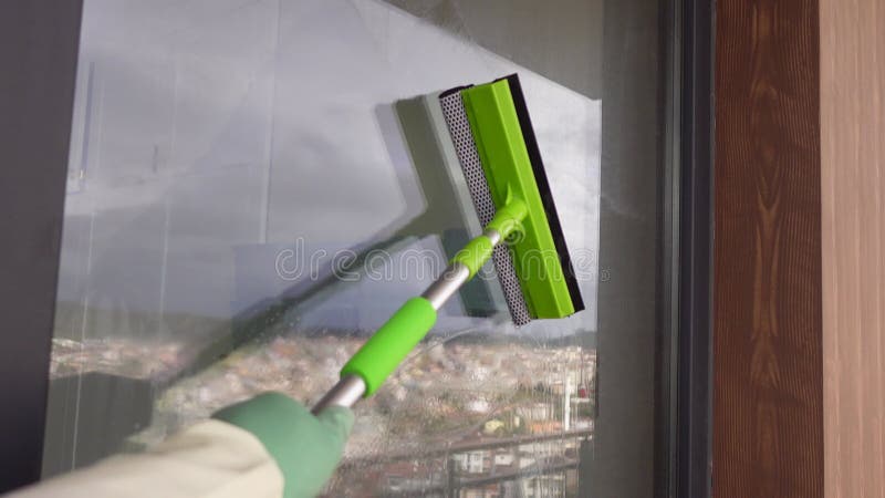 Rubber Squeegee Cleans a Soaped Window. Stock Video - Video of safety ...
