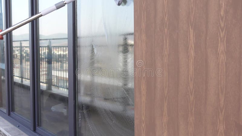 Rubber Squeegee Cleans a Soaped Window. Stock Video - Video of safety ...
