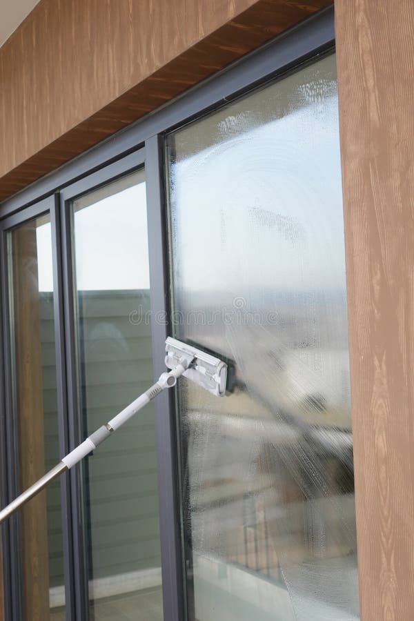 Rubber Squeegee Cleans a Soaped Window. Stock Image - Image of work ...