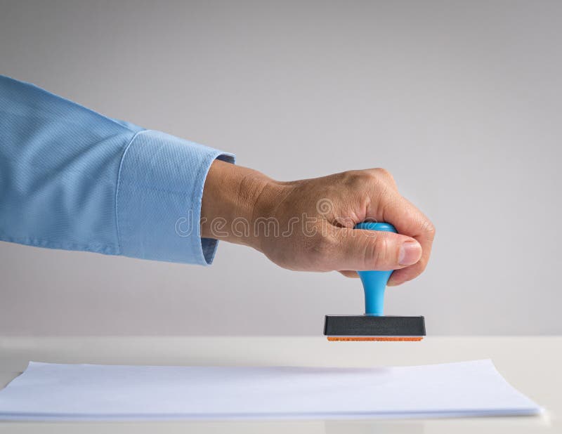 Rubber Stamp, Hand Pressing on Paper Stock Photo - Image of office ...