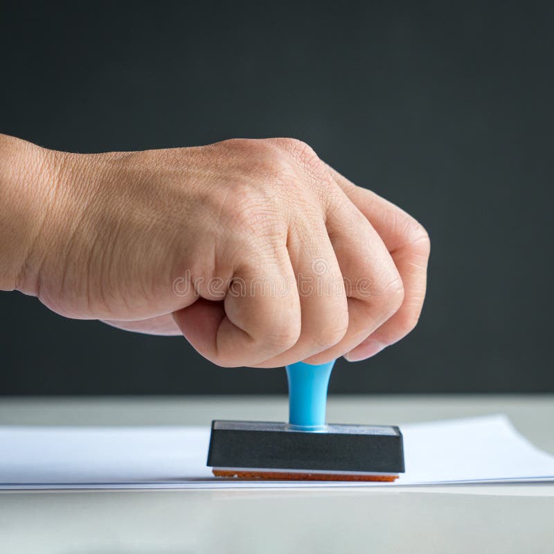 Rubber Stamp, Hand Pressing on Paper Stock Photo - Image of pressing ...