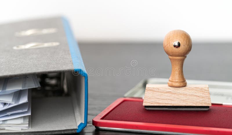 Rubber Stamp on Ink Pad on Wooden Desk Stock Photo - Image of file ...