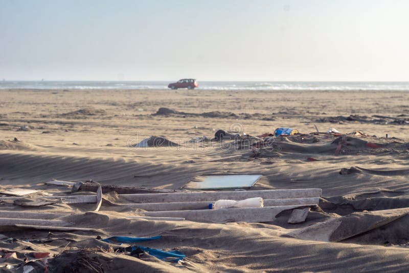 Rubbish on the Beach. Cardboard Boxes, Papers, Cans in the Sand Stock ...