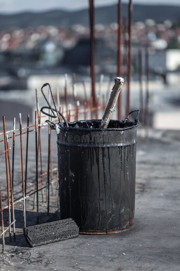 Rubbish Bin with Construction Waste and Instruments at the Construction ...