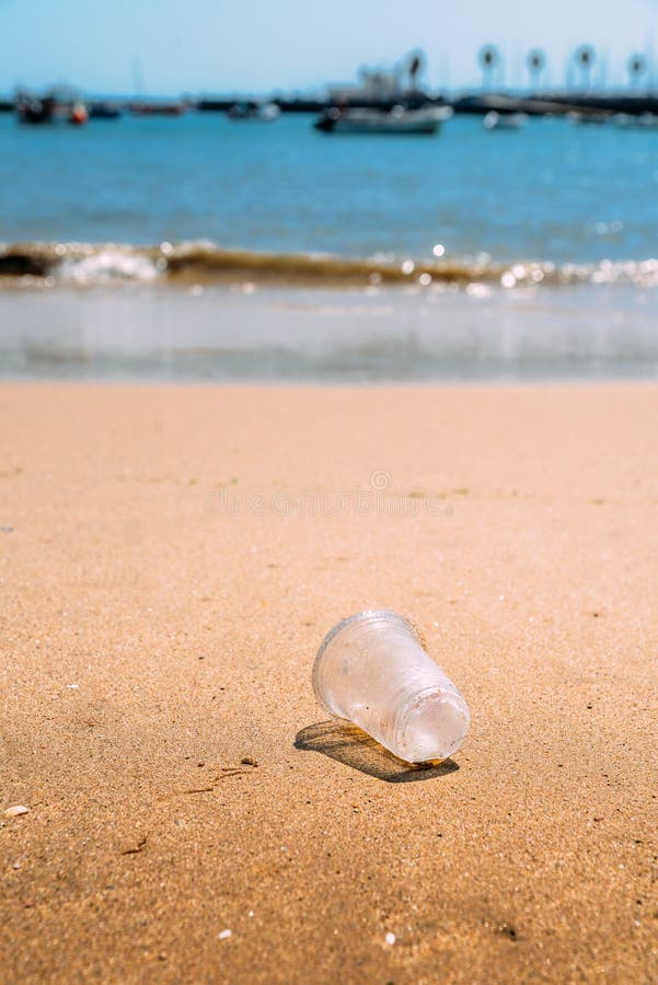 Rubbish Plastic Cup Left on the Beach Make Pollution Stock Image ...