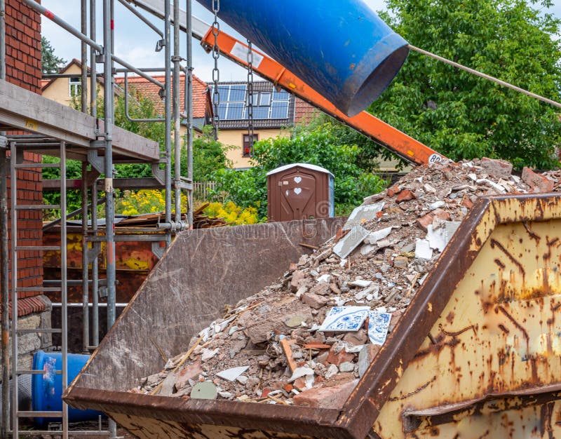 Rubble Chute with Debris and Container on a Construction Site Stock ...