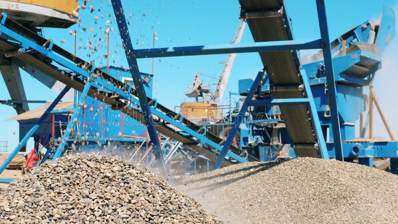 Rubble Falling from a Working Conveyor of a Crusher. Industrial Mining ...