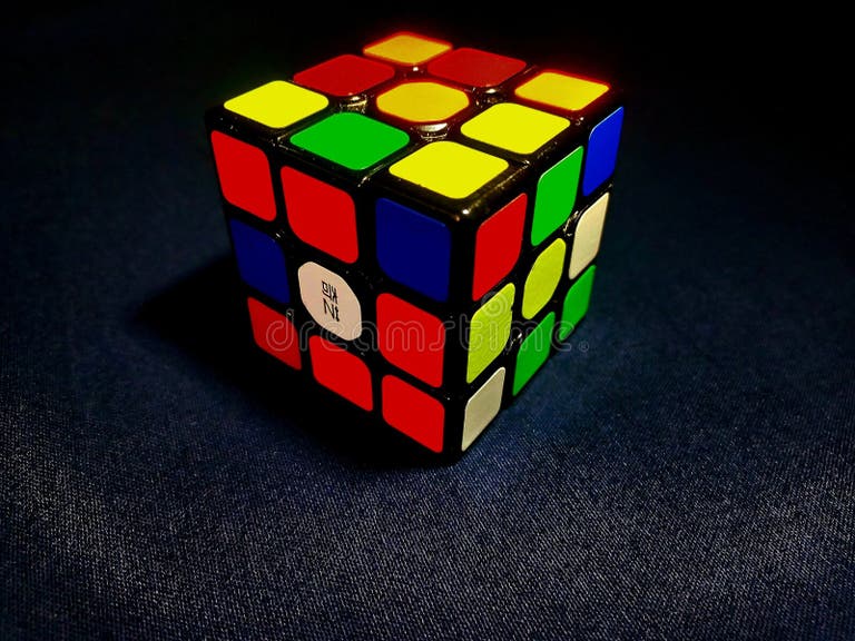 A Rubik S Cube Emerges in Three-dimensional Form Against a Stark Black ...
